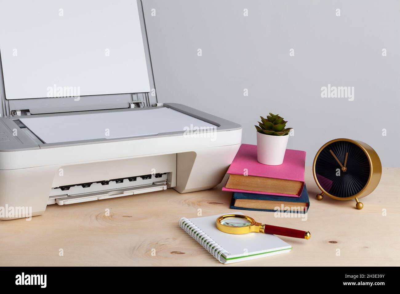 White scanner or printer machine on a table close up Stock Photo - Alamy