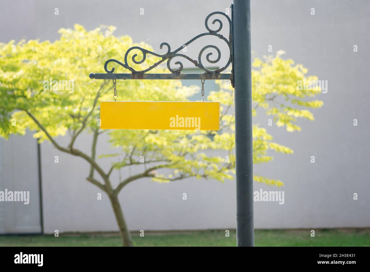 Yellow empty pole yard sign Stock Photo - Alamy