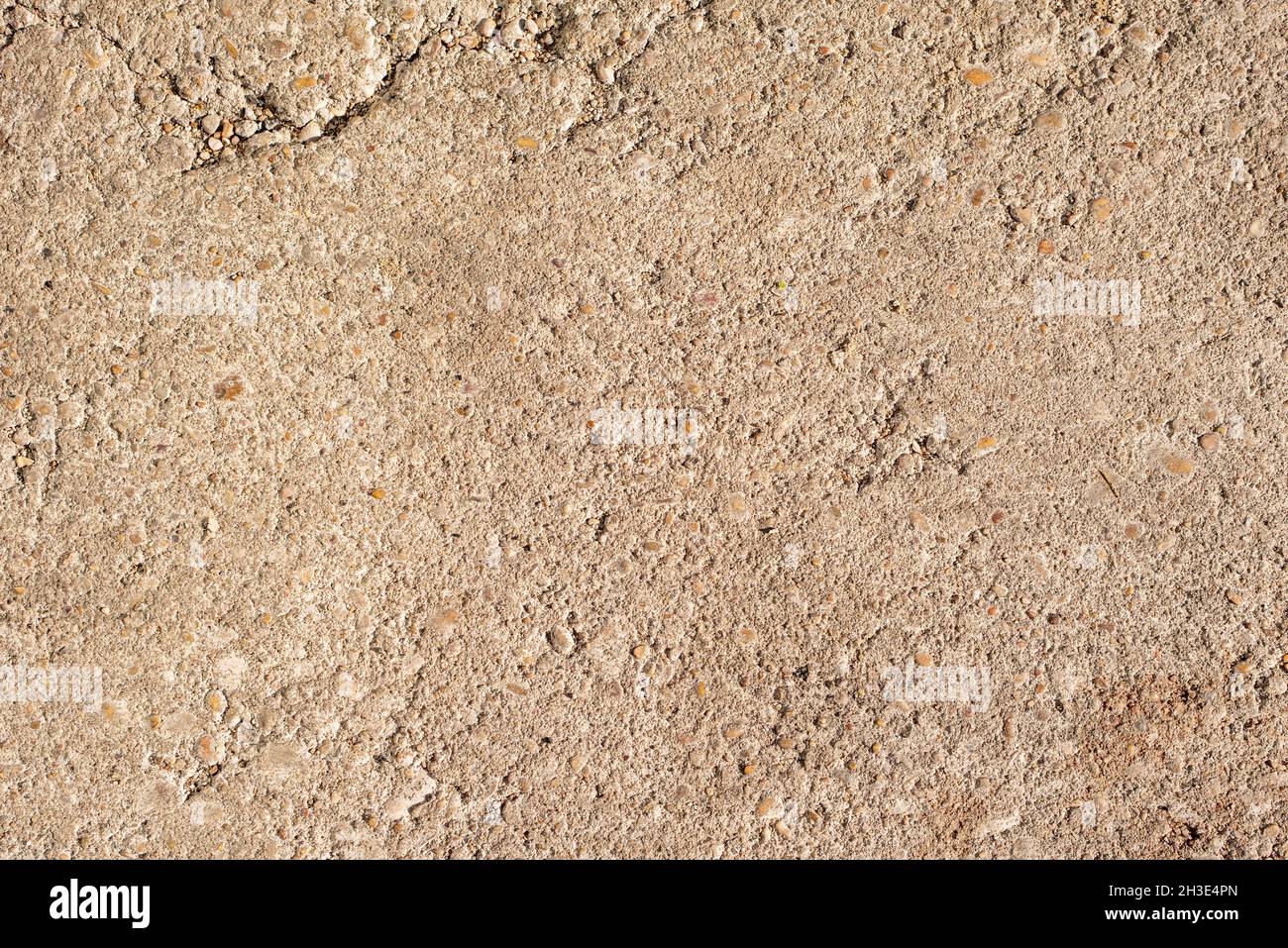 stone wall with sharp edged surface with various chips of stones ...