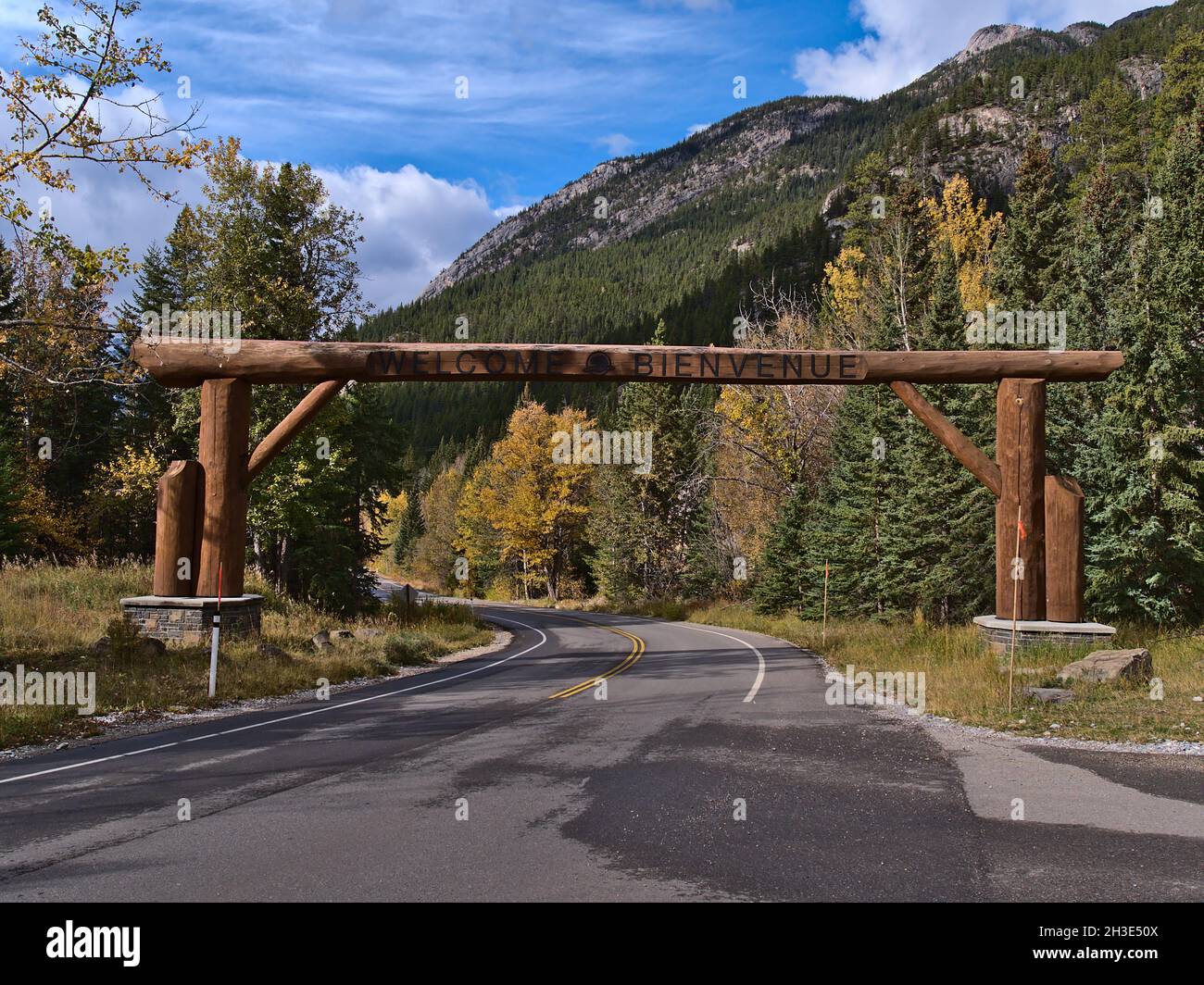 Wooden gate at the south entrance of famous Bow Valley Parkway in Banff ...