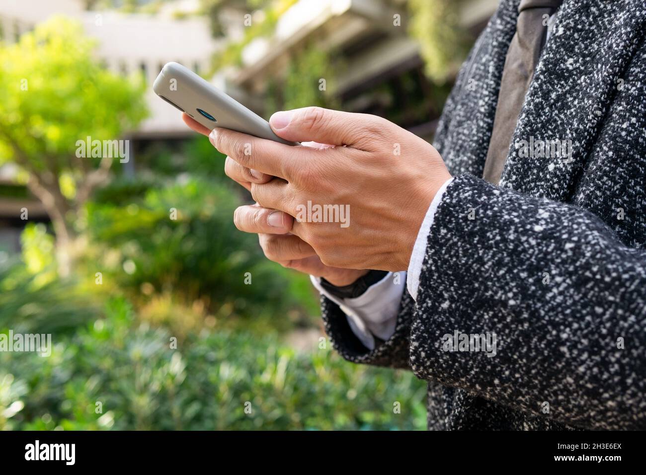 Trendy millennial ethnic female with long hair and raised arm looking ...