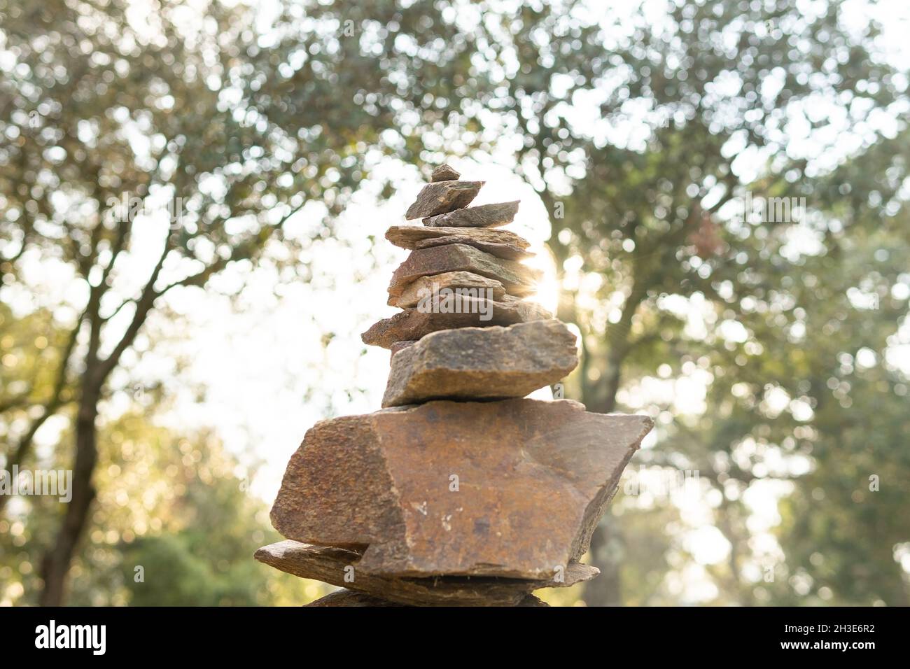 From below stones of various sizes and shapes stacked on each other in ...