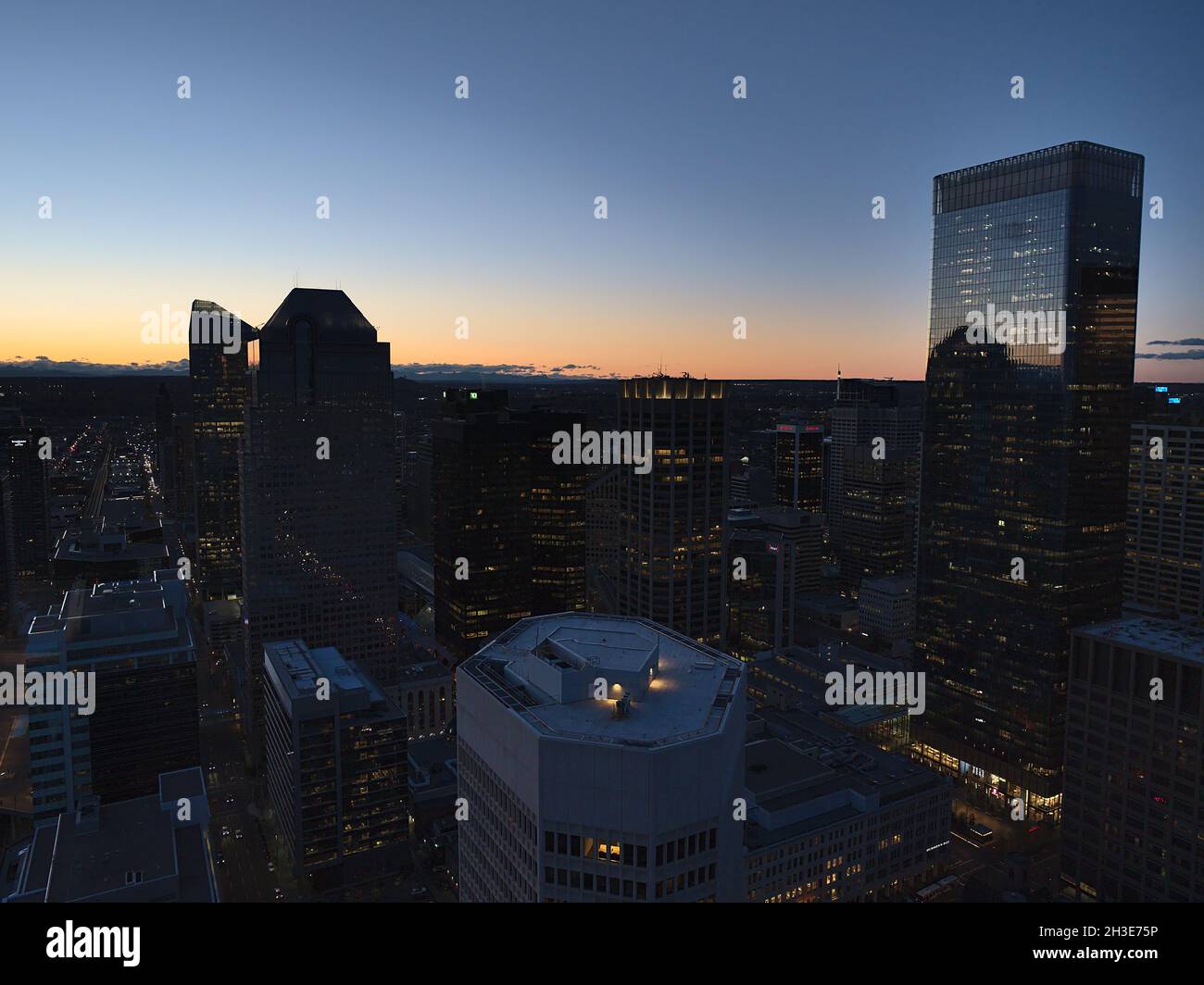Stunning aerial view of western Calgary downtown after sunset with the ...
