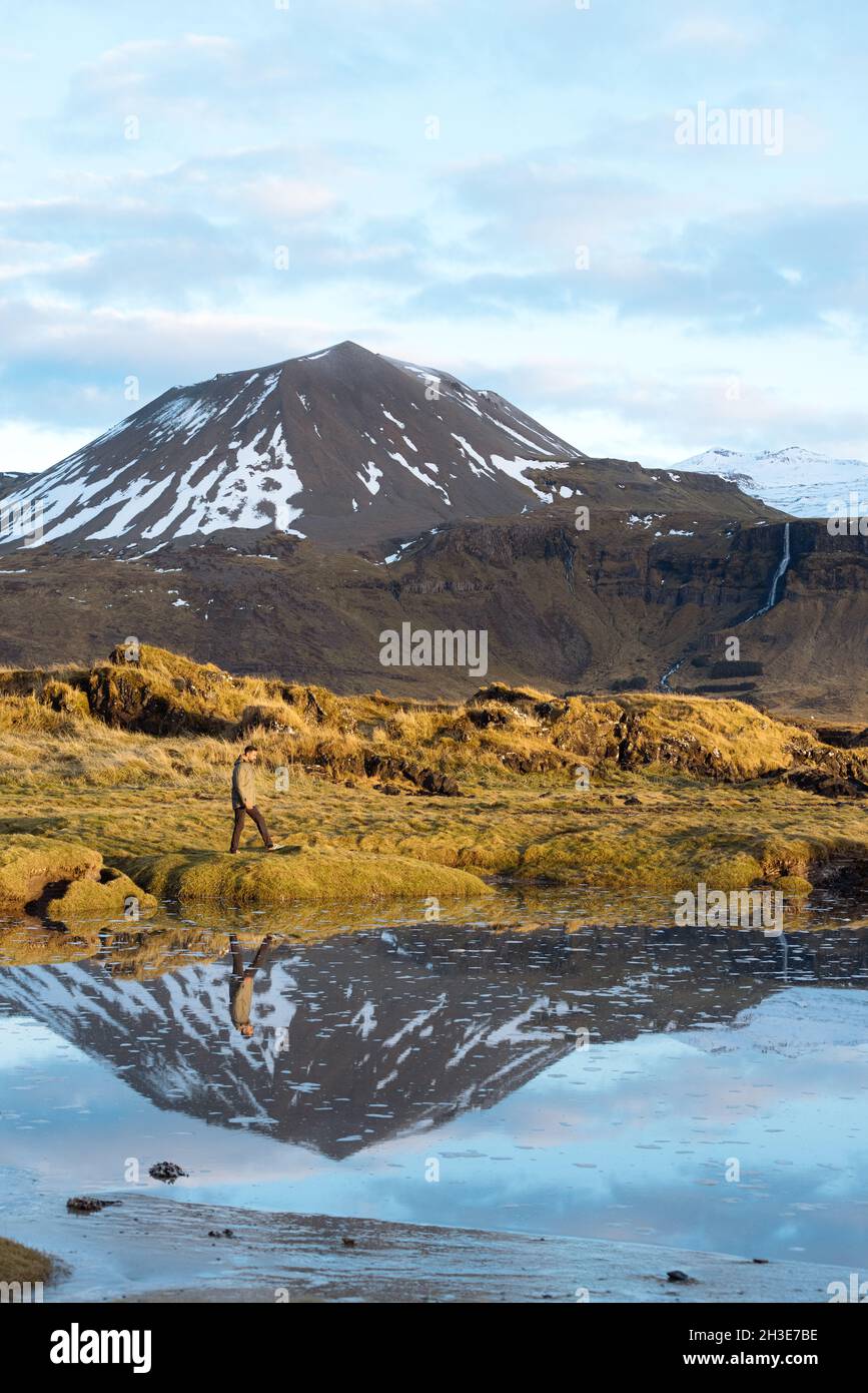 Side view of full body flexible female wearing light pink rash guard ...