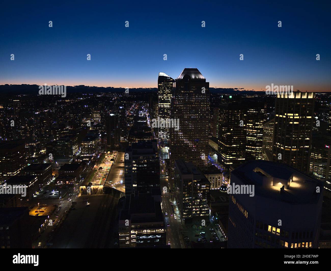 Stunning aerial view of western Calgary downtown with illuminated ...