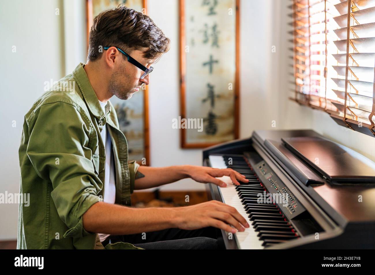 Cropped unrecognizable female doctor in white robe taking notes on ...