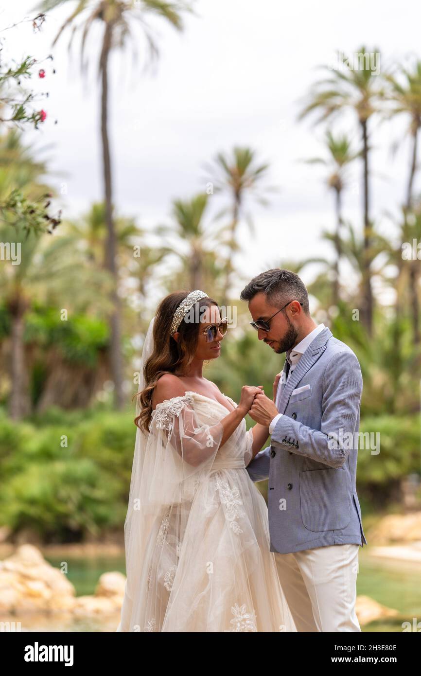 Bearded male worker in formal wear looking at camera while sitting near ...