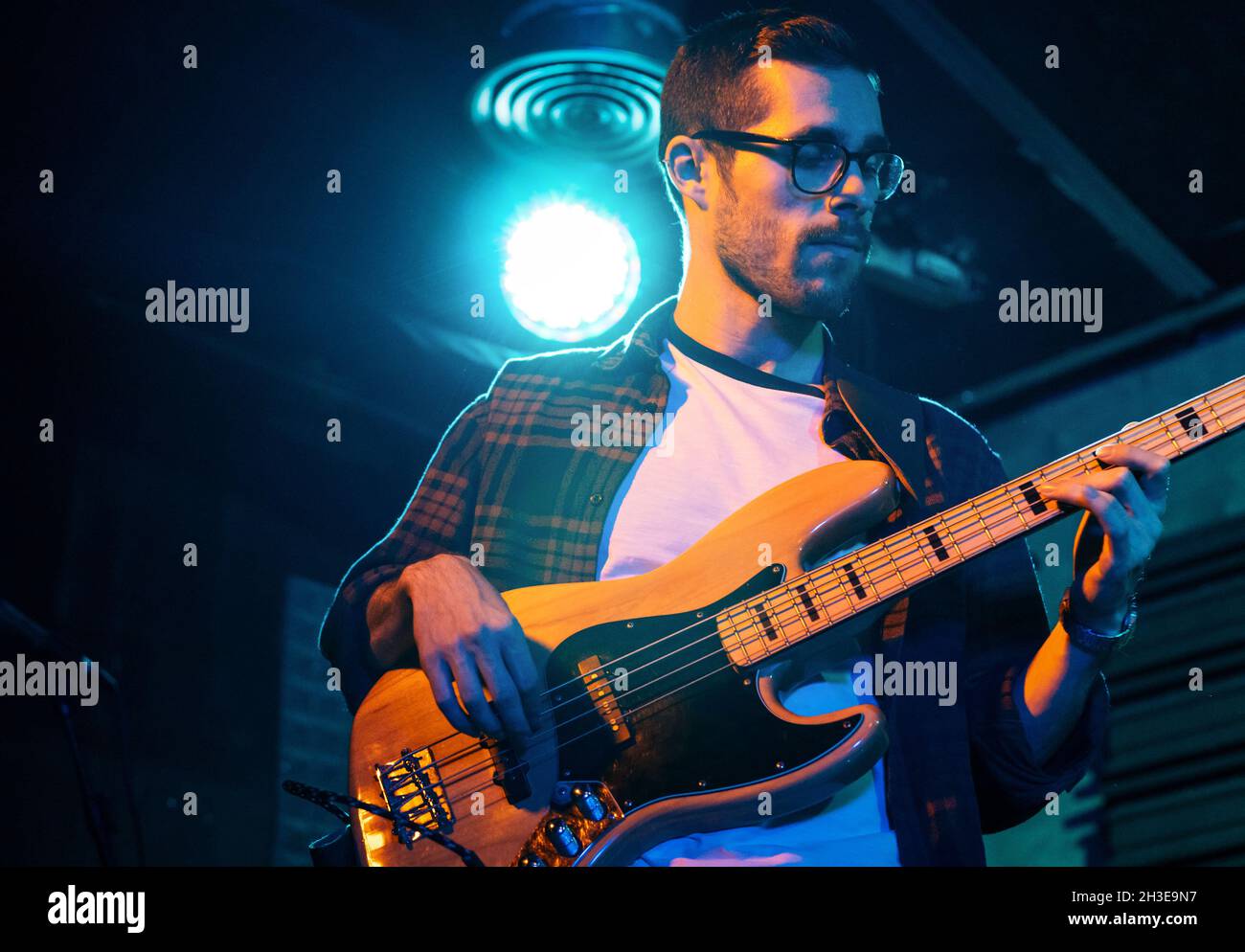 Man playing bass guitar hi-res stock photography and images - Alamy
