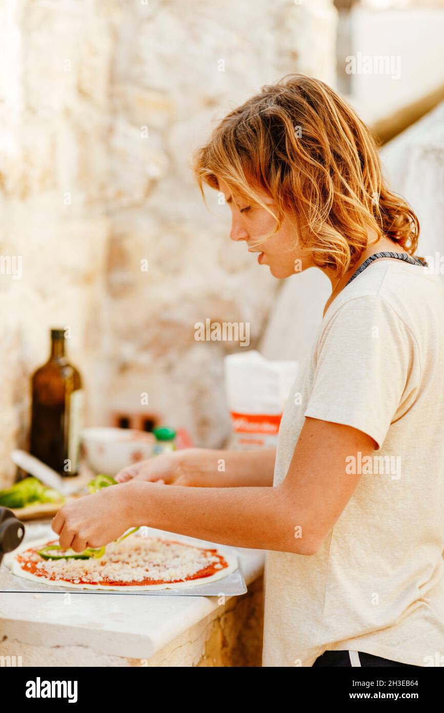 Homemade pizza baking with outdoor traditional pizza over Stock Photo ...