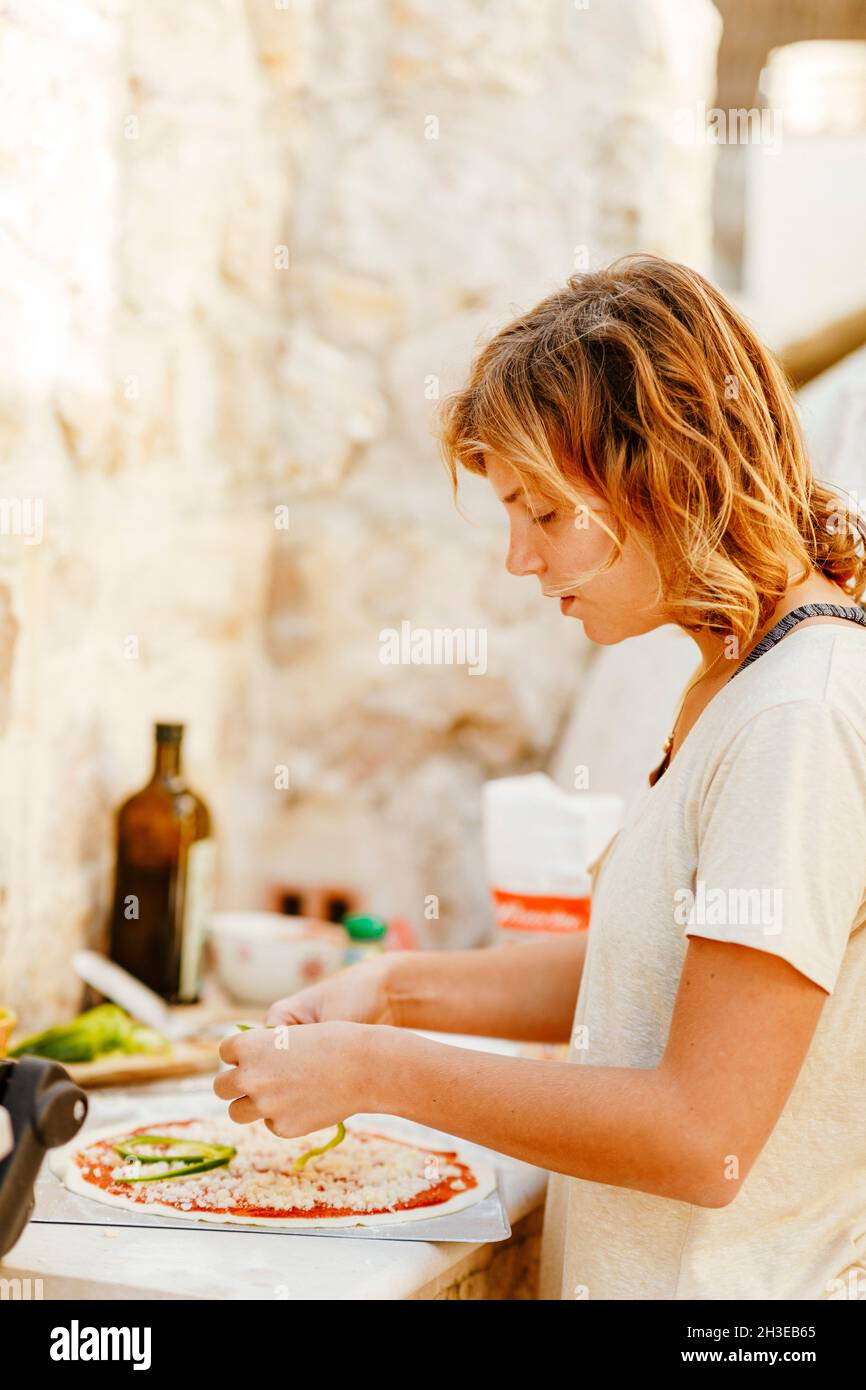 Homemade pizza baking with outdoor traditional pizza over Stock Photo ...