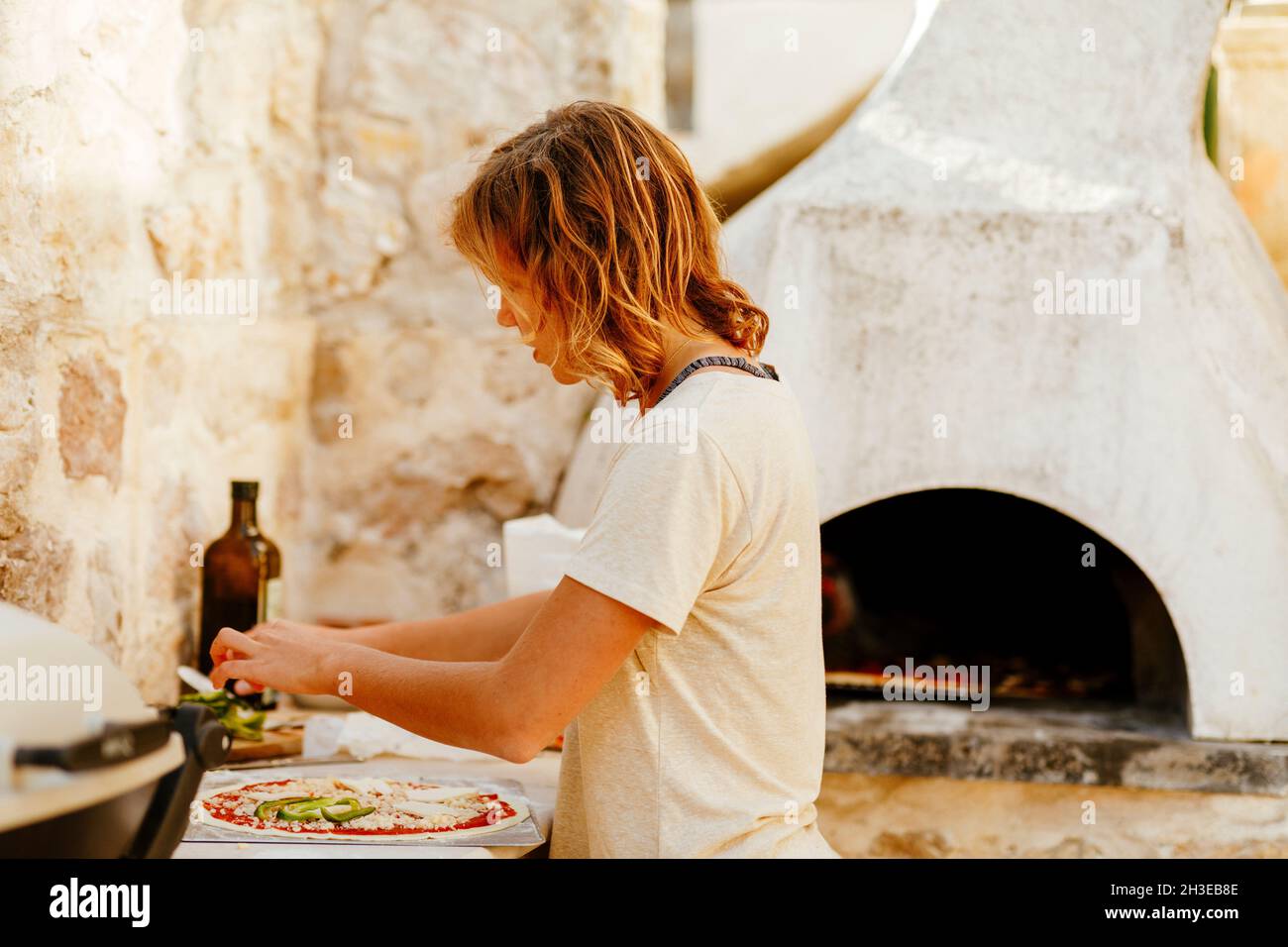 Homemade pizza baking with outdoor traditional pizza over Stock Photo ...