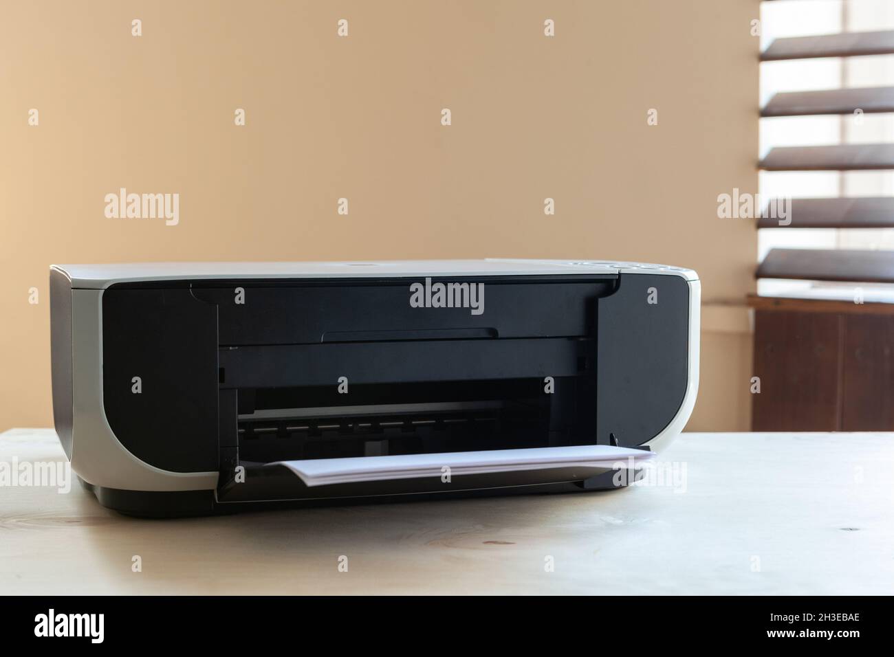 Close up of an office table with printer on it Stock Photo - Alamy