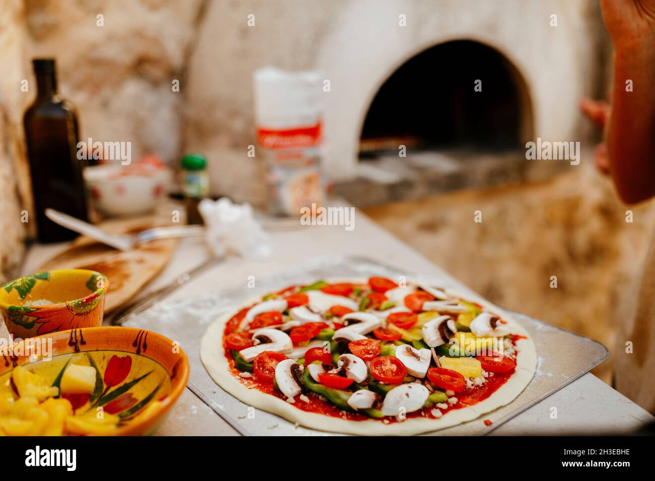 Homemade pizza baking with outdoor traditional pizza over Stock Photo ...