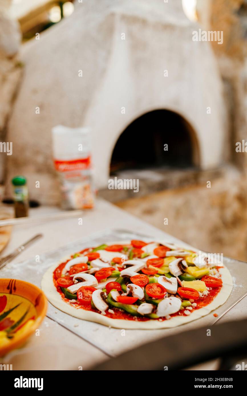 Homemade pizza baking with outdoor traditional pizza over Stock Photo ...