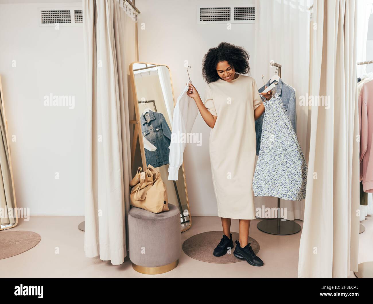 Woman in clothes dressing room hi-res stock photography and images - Alamy