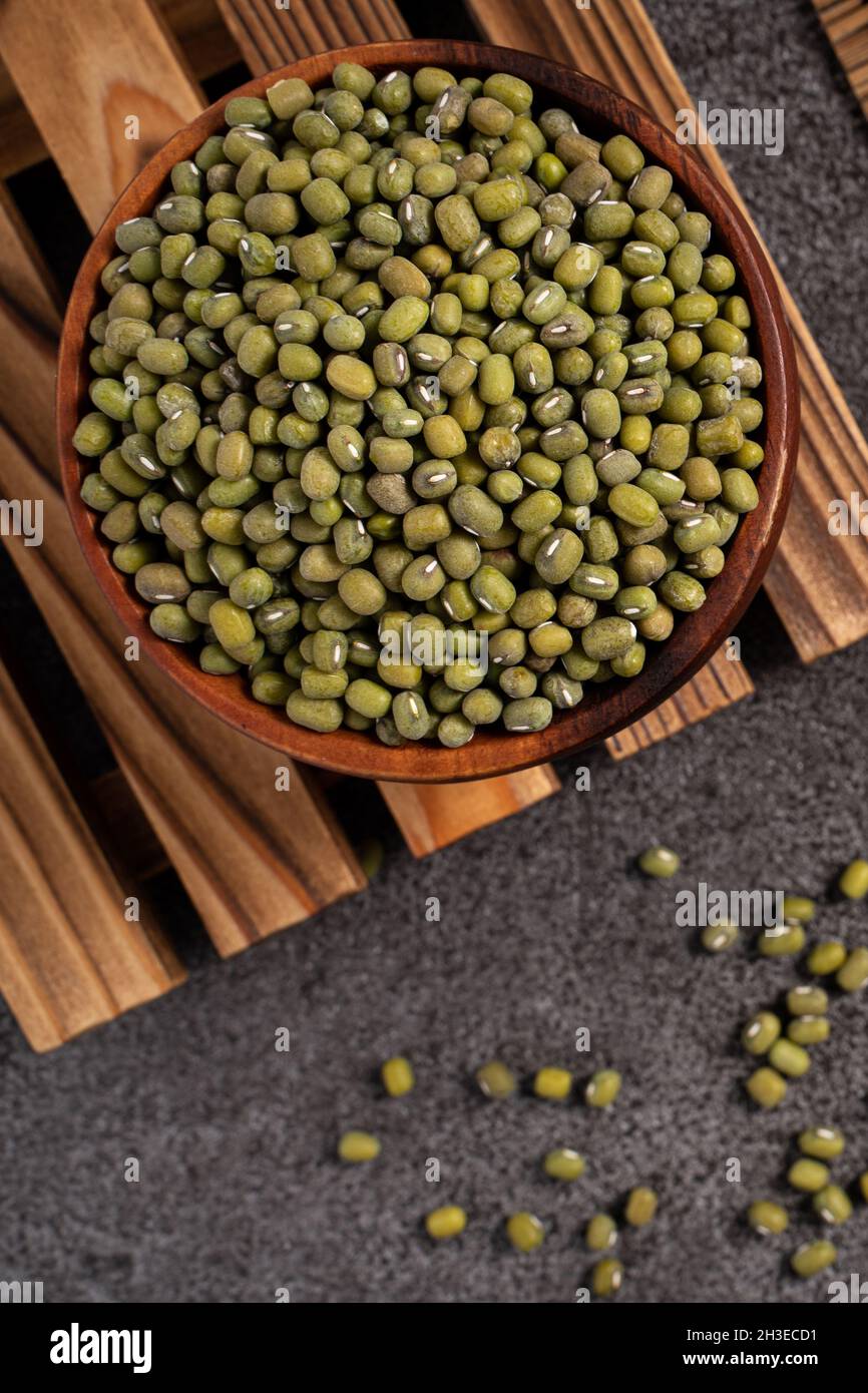Top view of raw mung bean in a bowl on wooden table background Stock ...