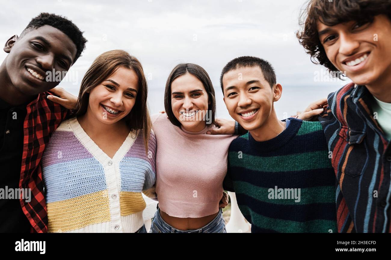 Portrait of multiracial friends having fun smiling on camera outdoor ...