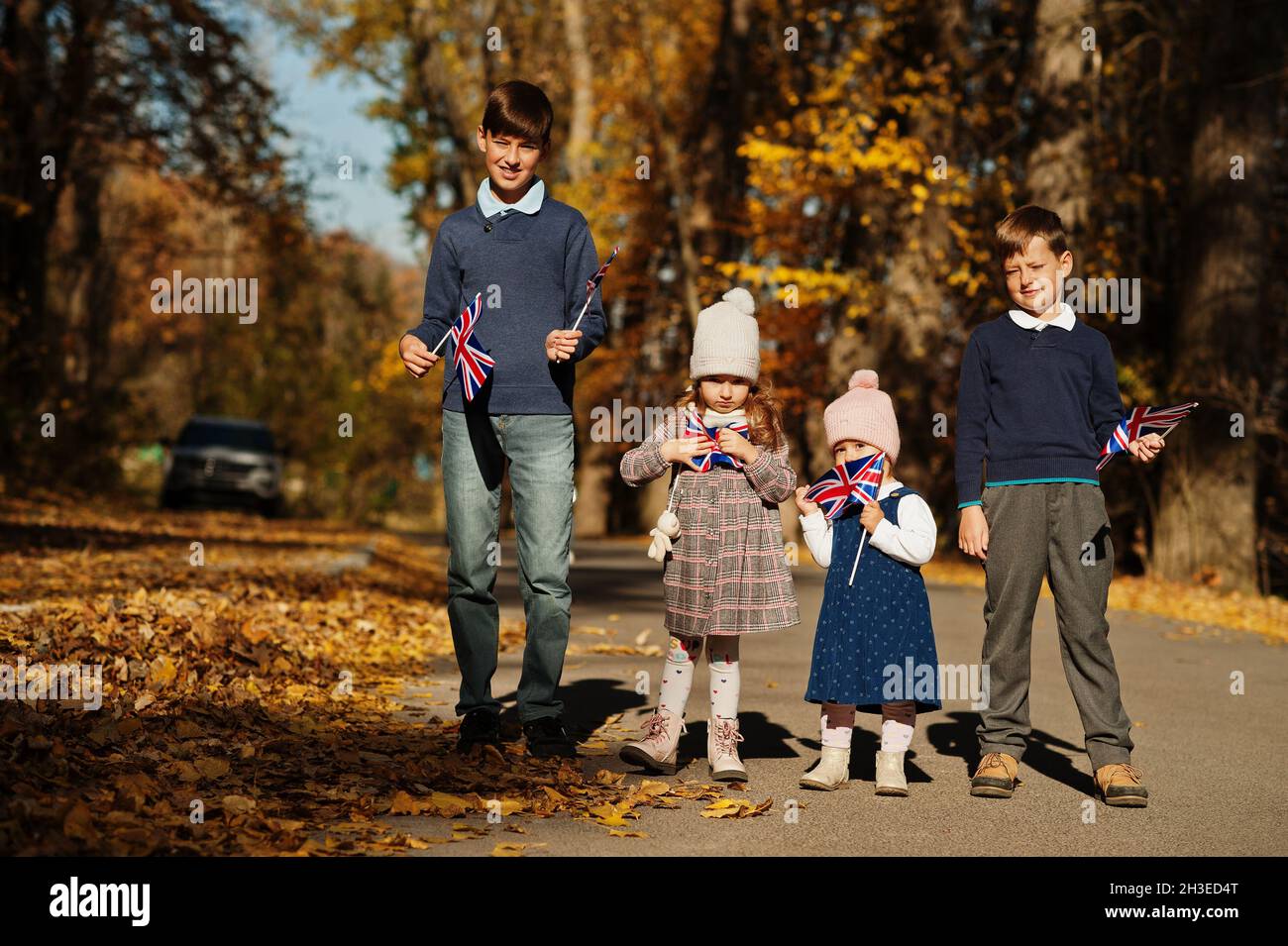 National holiday of United Kingdom. Four kids with british flags in ...