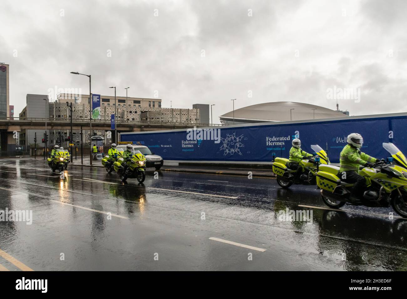 Police motorbikes on the wet road near the Blue Zone for COP26. Police ...