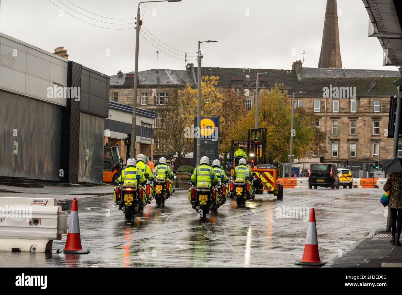 Police motorbikes on the wet road near the Blue Zone for COP26. Police ...