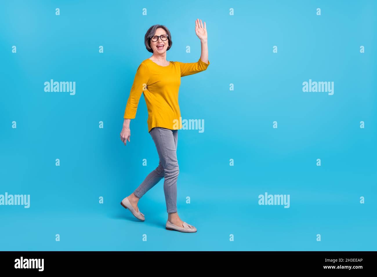 Full length body size view of attractive cheerful glad woman going ...