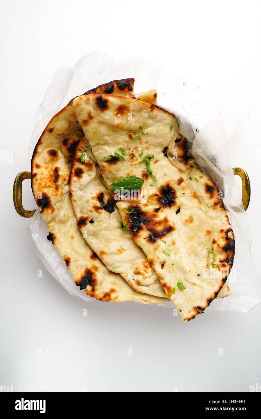Fresh Tandoori Roti or Butter Naan isolated on white, selective focus ...