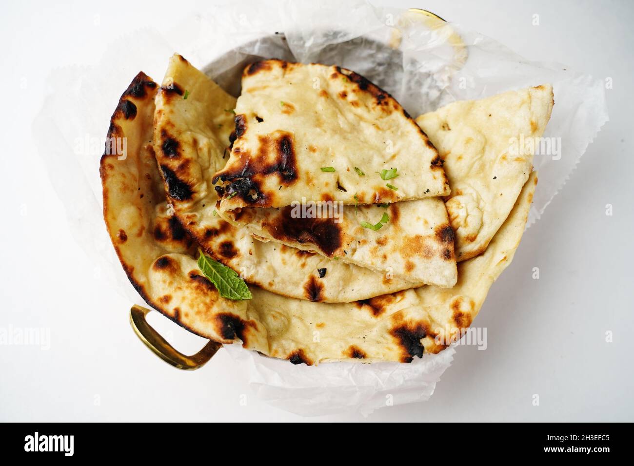 Fresh Tandoori Roti or Butter Naan isolated on white, selective focus ...