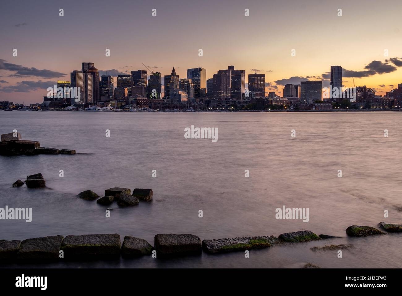 Boston skyline at sunset, located in Fan Pier Park, Boston ...