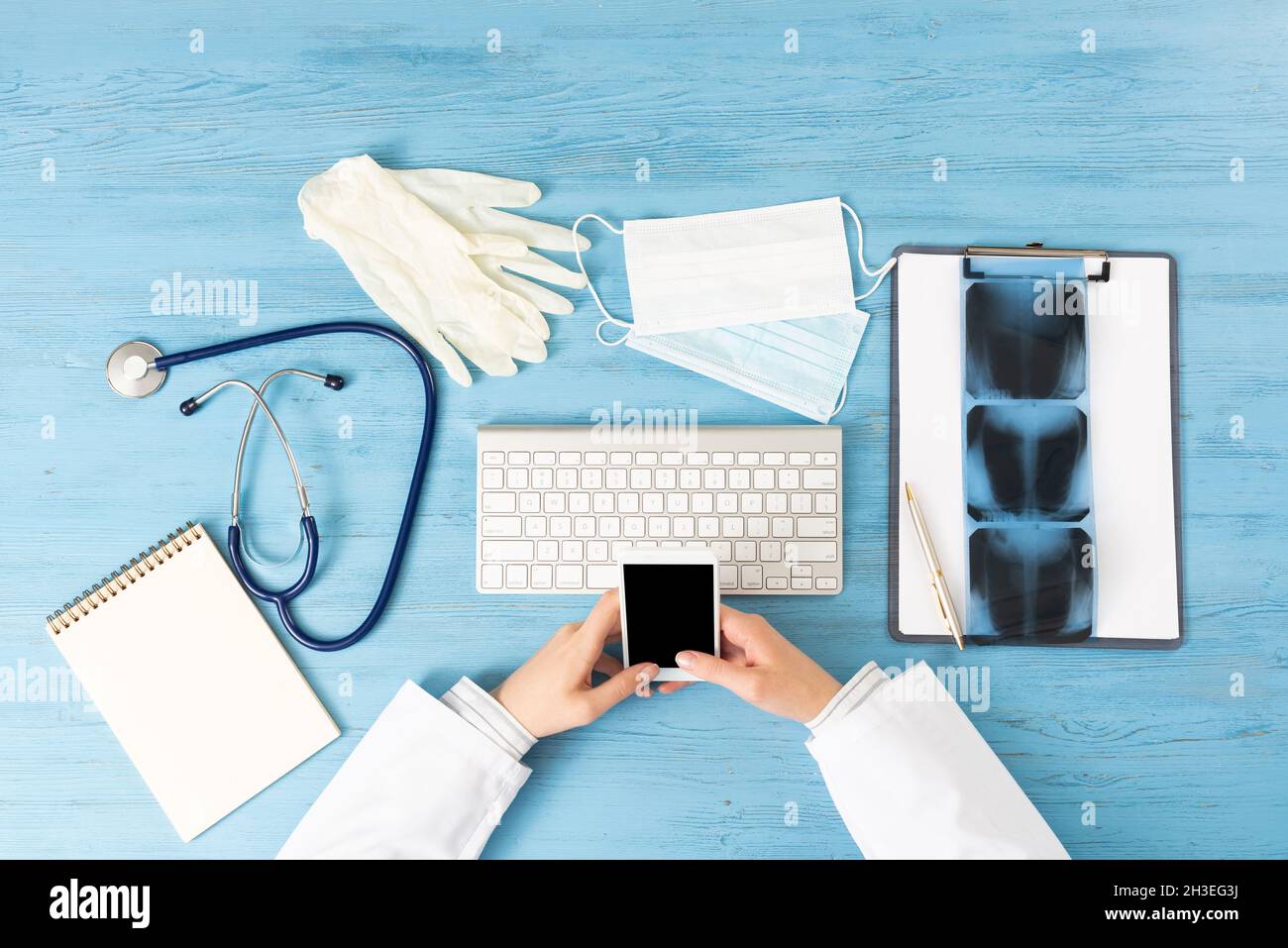 Top view of doctor hand holding smartphone Stock Photo - Alamy