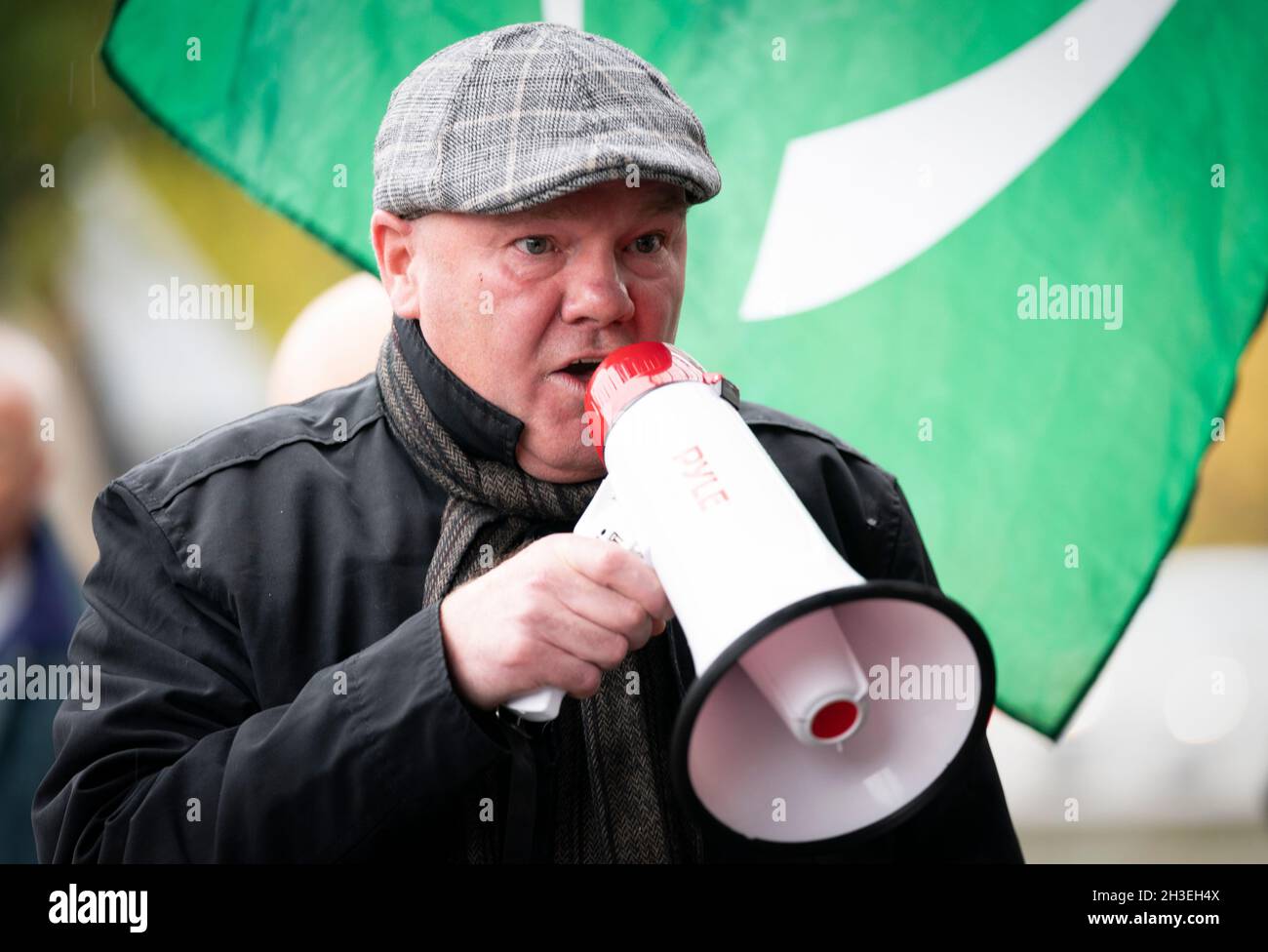 Mick Hogg, Scottish organiser at the RMT union speaks at a rally ...