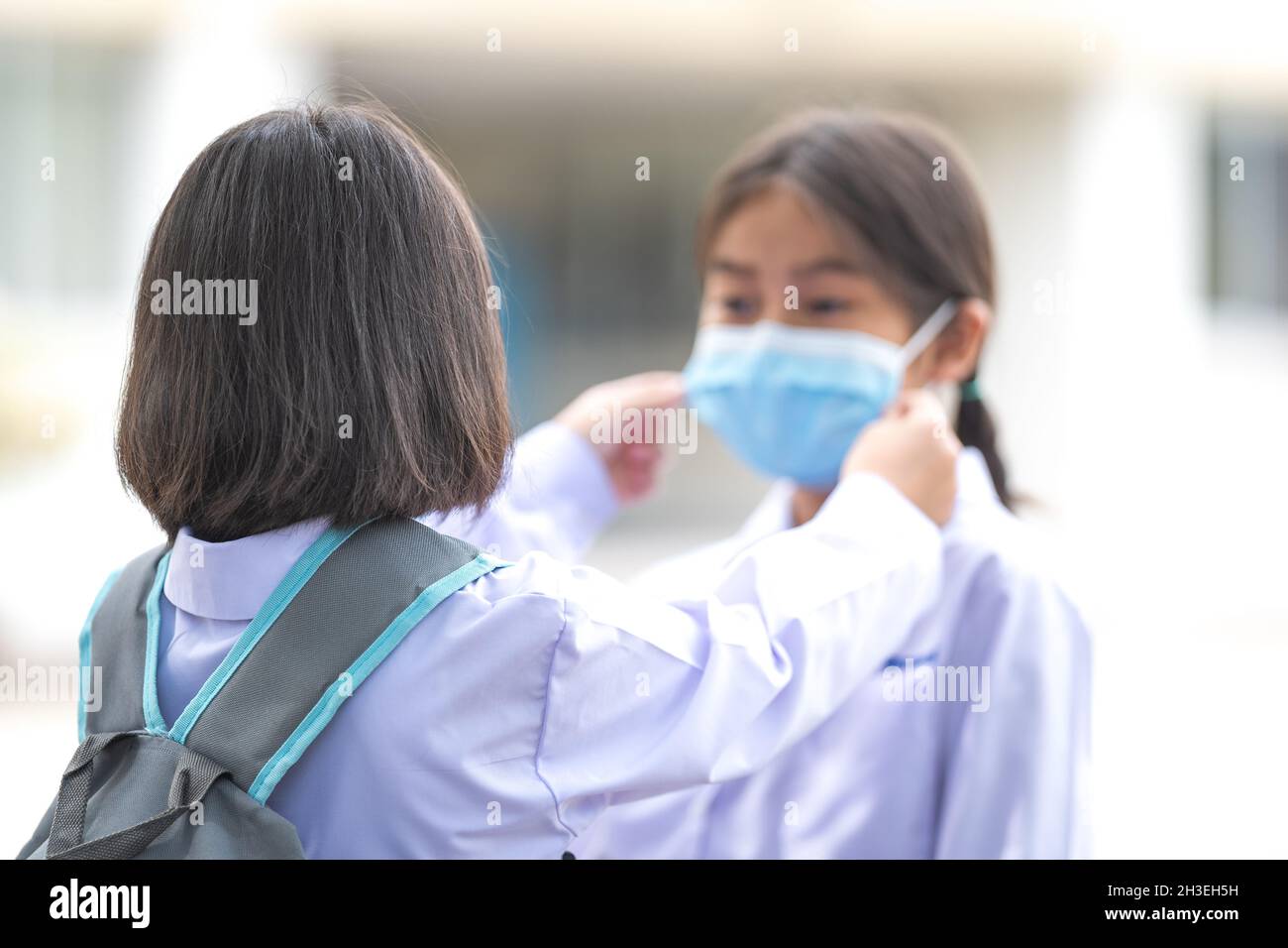 Helping a friend kids hi-res stock photography and images - Alamy