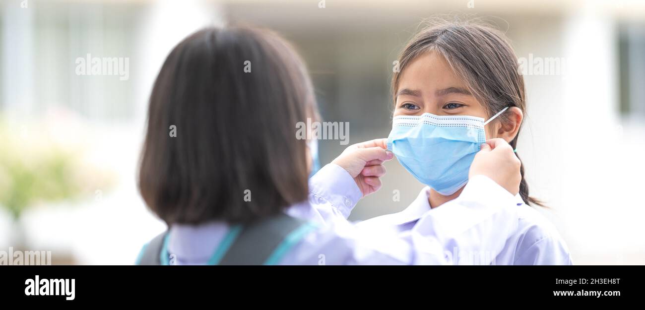 Helping a friend kids hi-res stock photography and images - Alamy