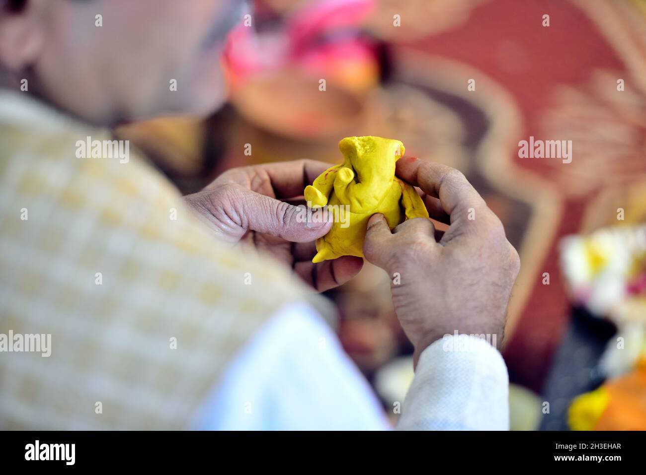 Indian priest made lord Ganesh from flour mixed with turmeric ghee ...