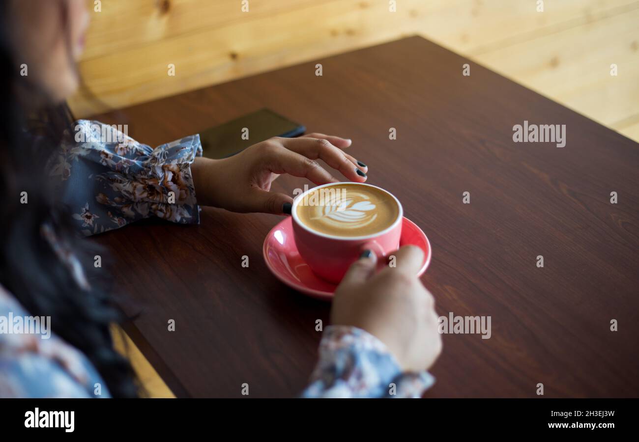 Person drinking latte hi-res stock photography and images - Alamy