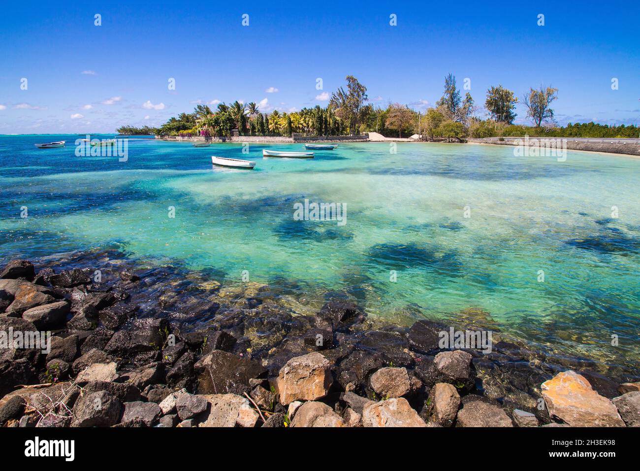 Blue indian ocean view of Mauritius with blue water and sky rock beach ...