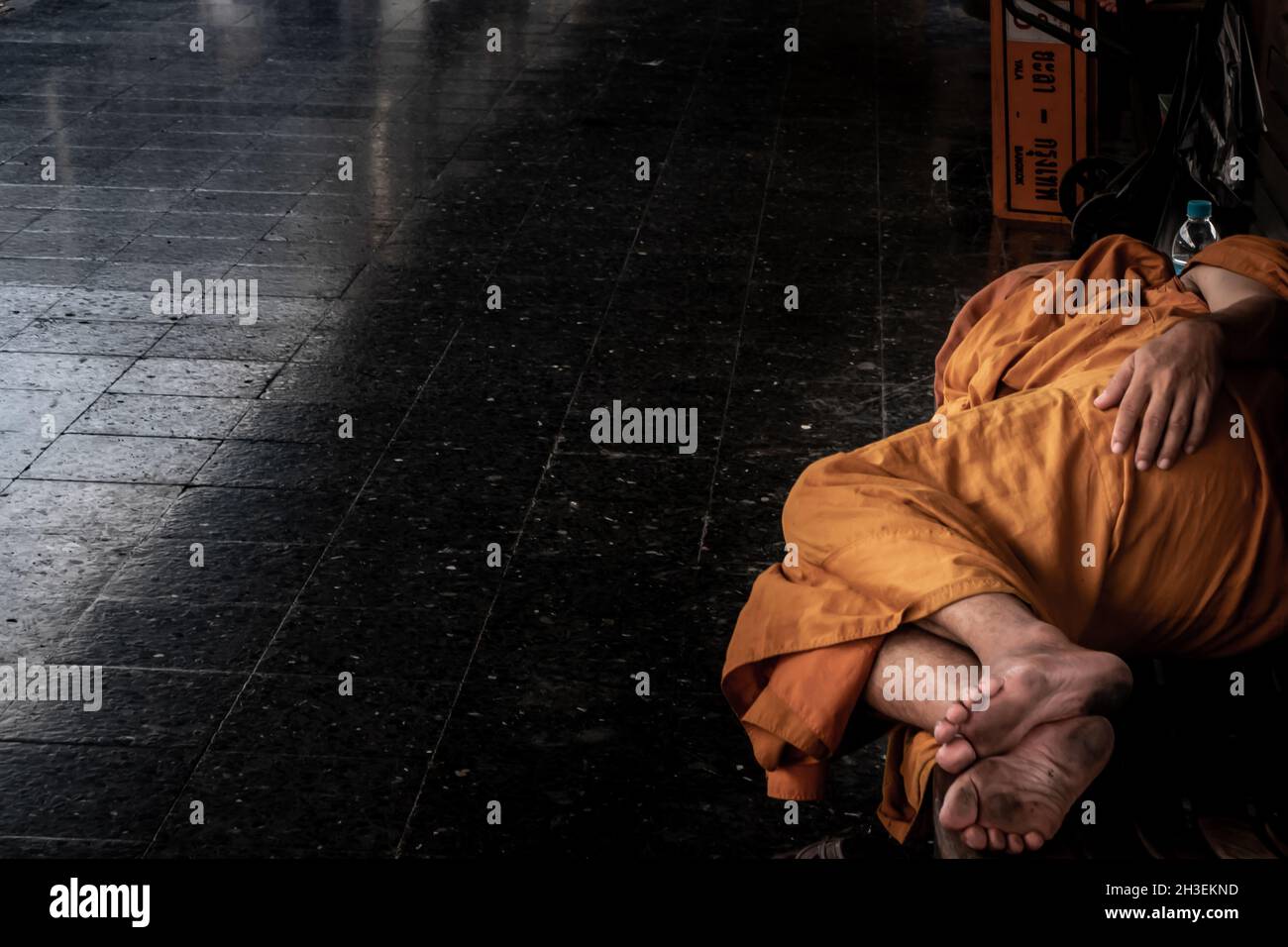 Bangkok, thailand - Jul 7, 2019 : A monk is sleep on wooden chairs are ...