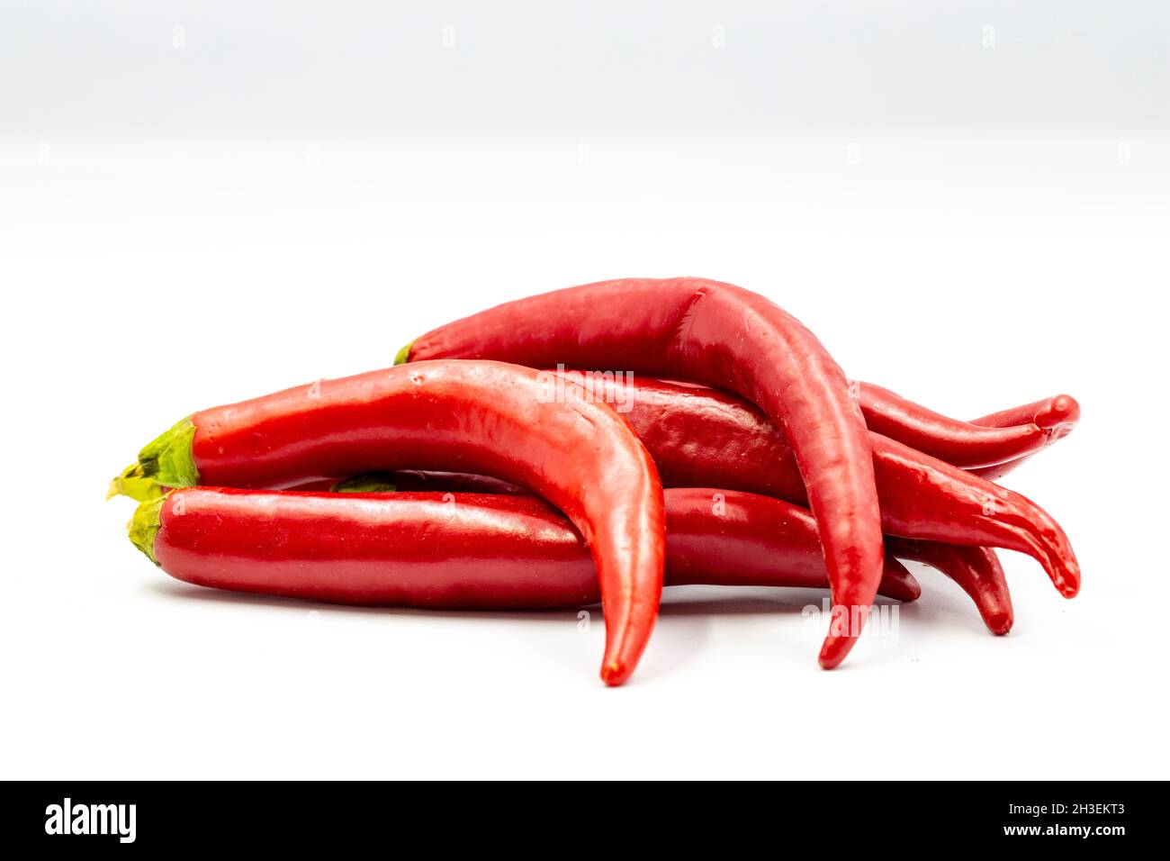 Red hot chili pepper on white background with shadow. close up Stock ...