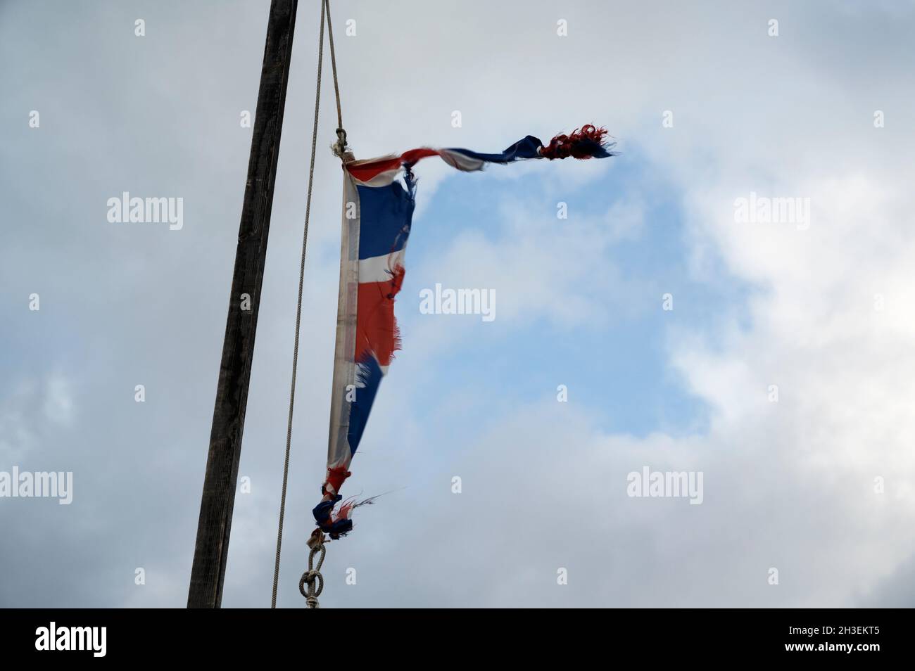 Hastings, October 2021. Frayed remains of Union Jack Stock Photo - Alamy