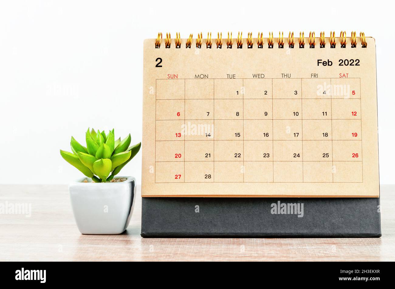 The February desk calendar 2021 on wooden background Stock Photo - Alamy