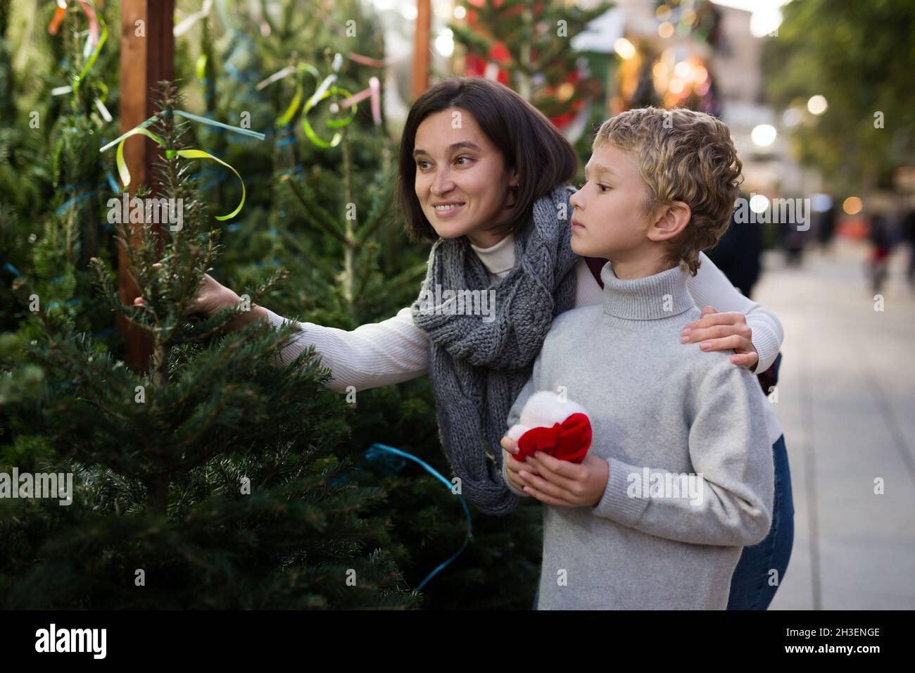 Choosing festive present smiling hi-res stock photography and images ...
