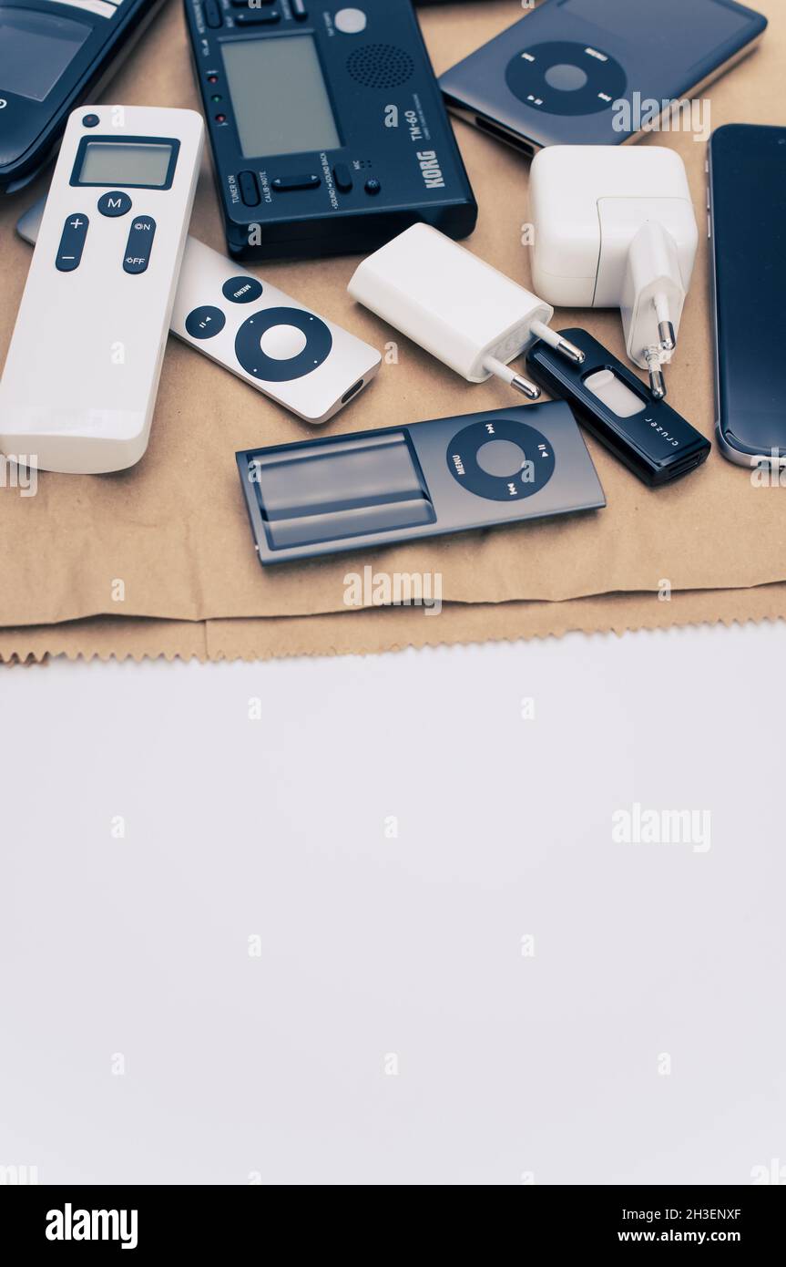 various consumer electronics and gadgets devices randomly placed on a ...