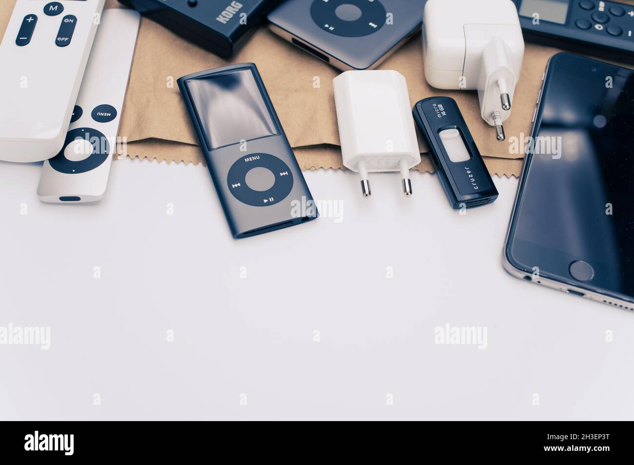various consumer electronics and gadgets devices randomly placed on a ...
