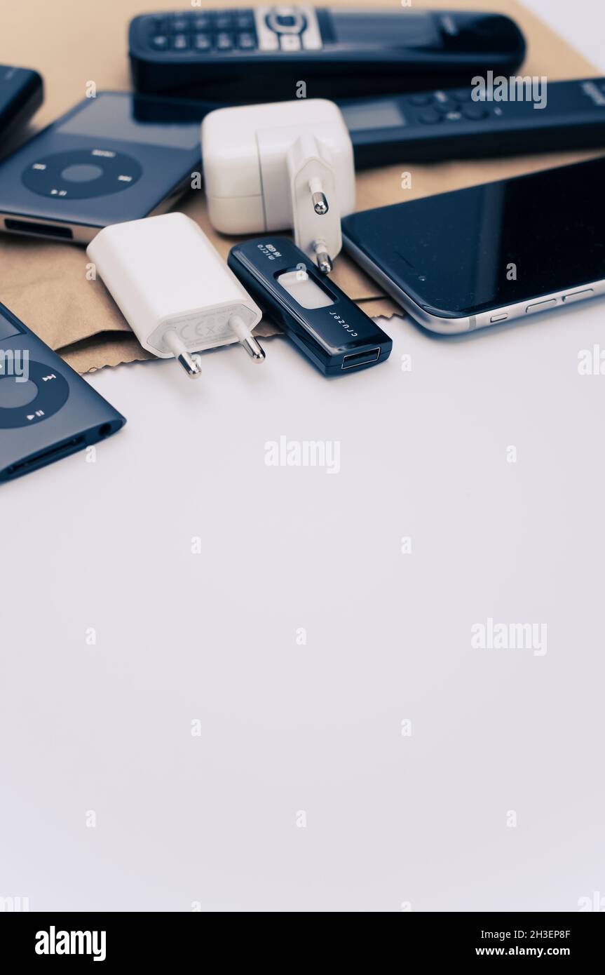 various consumer electronics and gadgets devices randomly placed on a ...