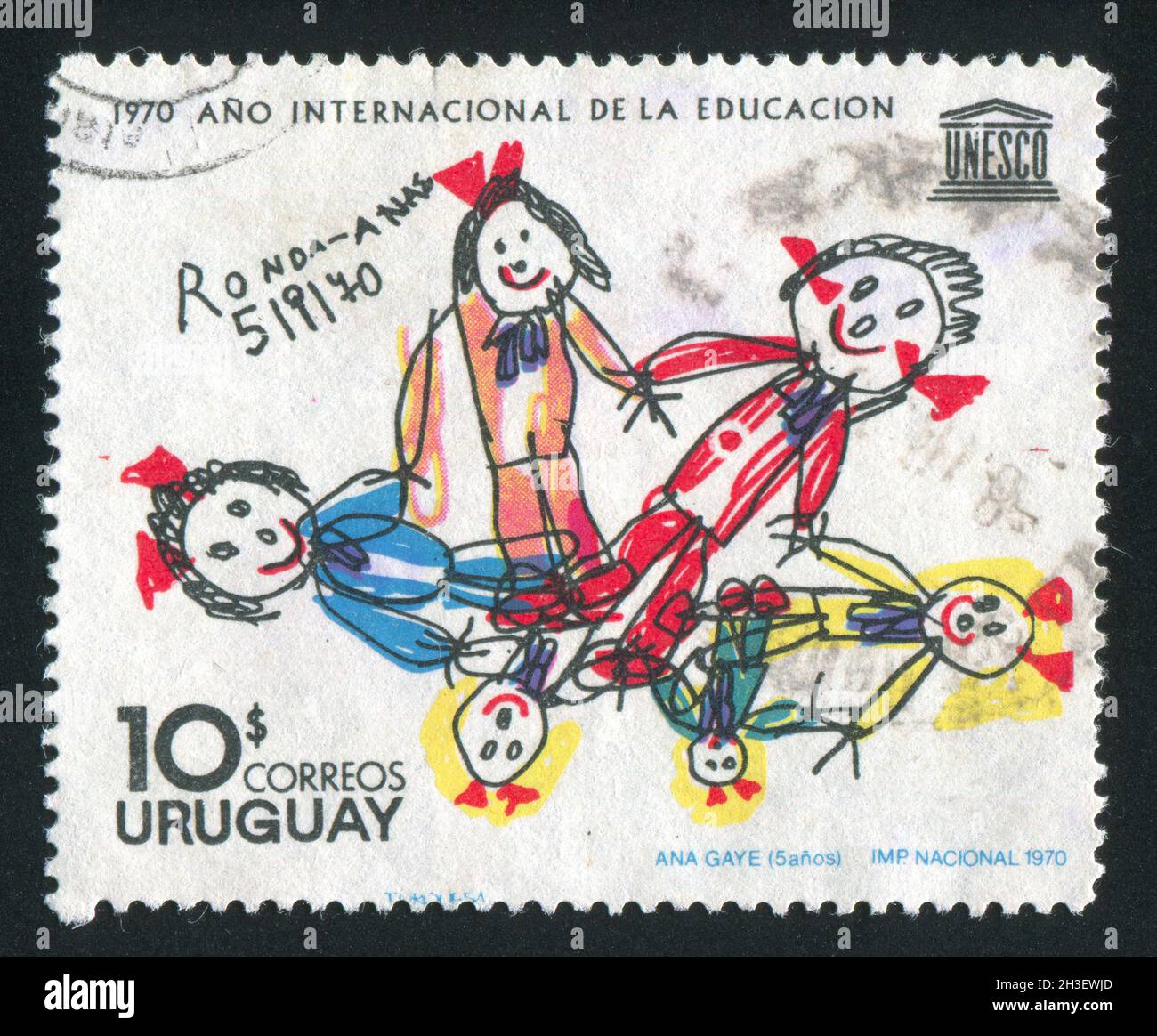 URUGUAY - CIRCA 1970: stamp printed by Uruguay, shows Children Holding Hands and UNESCO Emblem ...