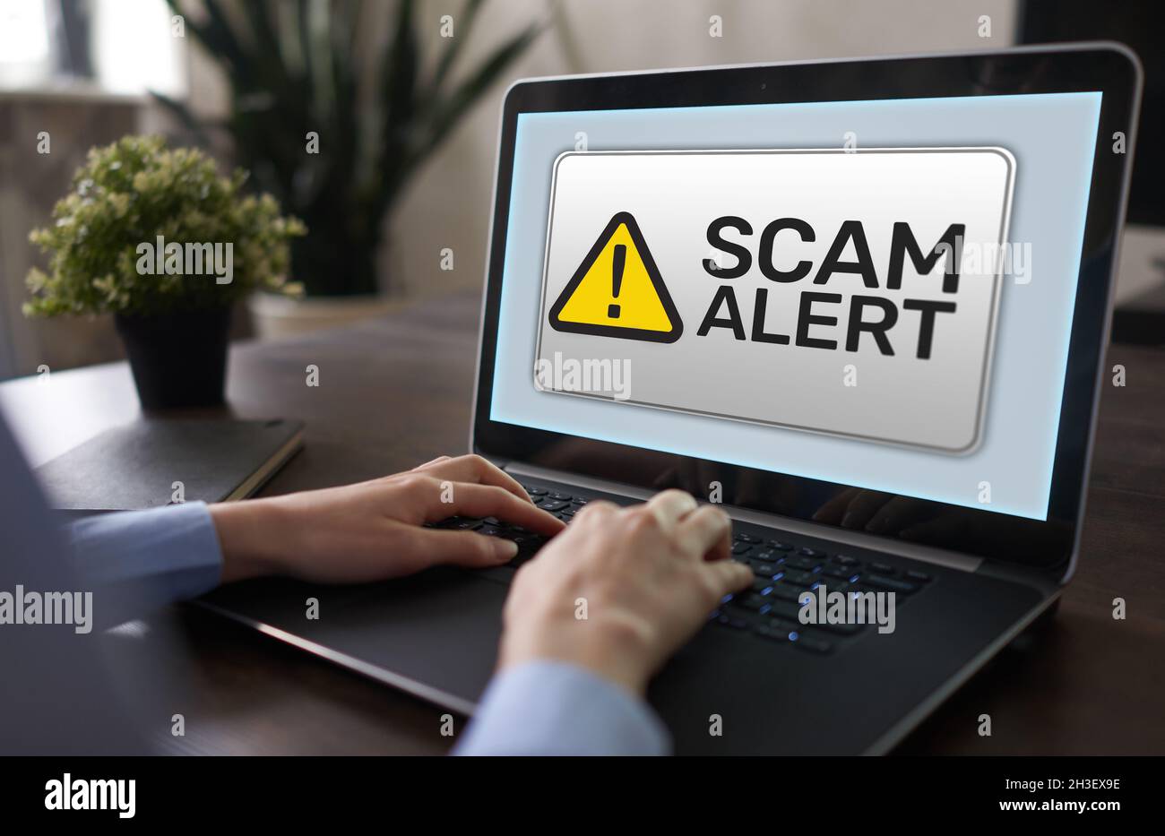 Scam alert detecting warning. Notification on device screen Stock Photo ...