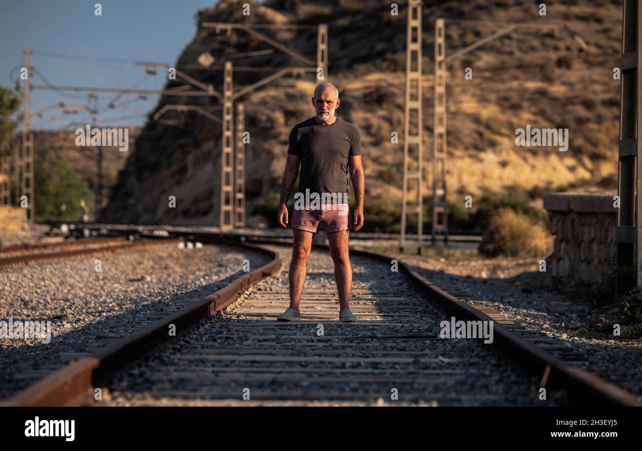 Man walking on railway track hi-res stock photography and images - Alamy