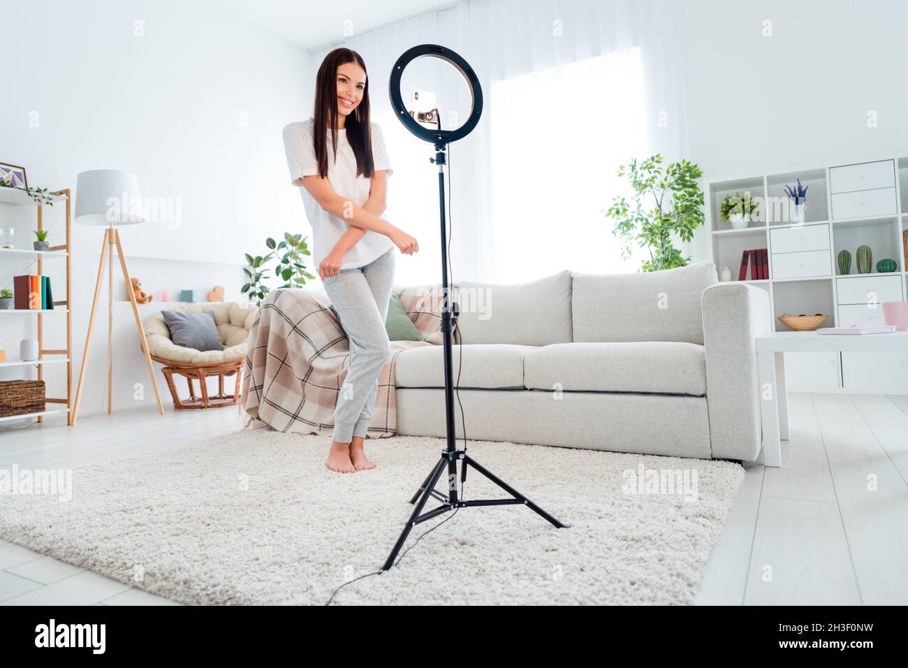 Photo of positive influencer blogger lady dance move tripod phone ...