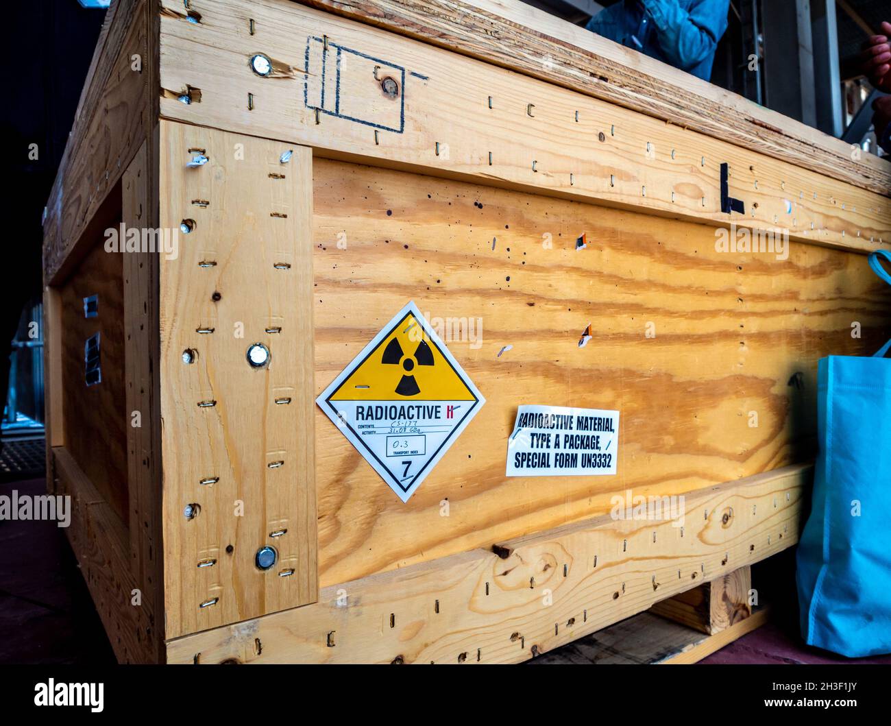 The radioactive material label beside the transportation wooden box ...