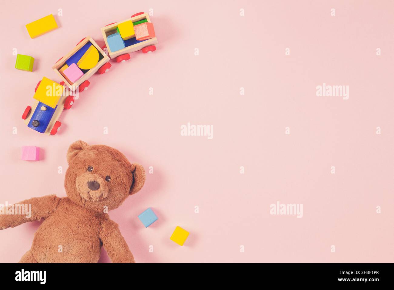 Baby kids toys frame with teddy bear, toy train, colorful wooden bricks ...