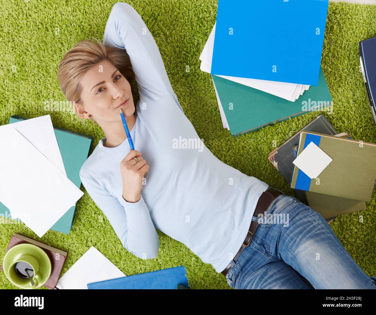 Woman surrounded by paperwork hi-res stock photography and images - Alamy